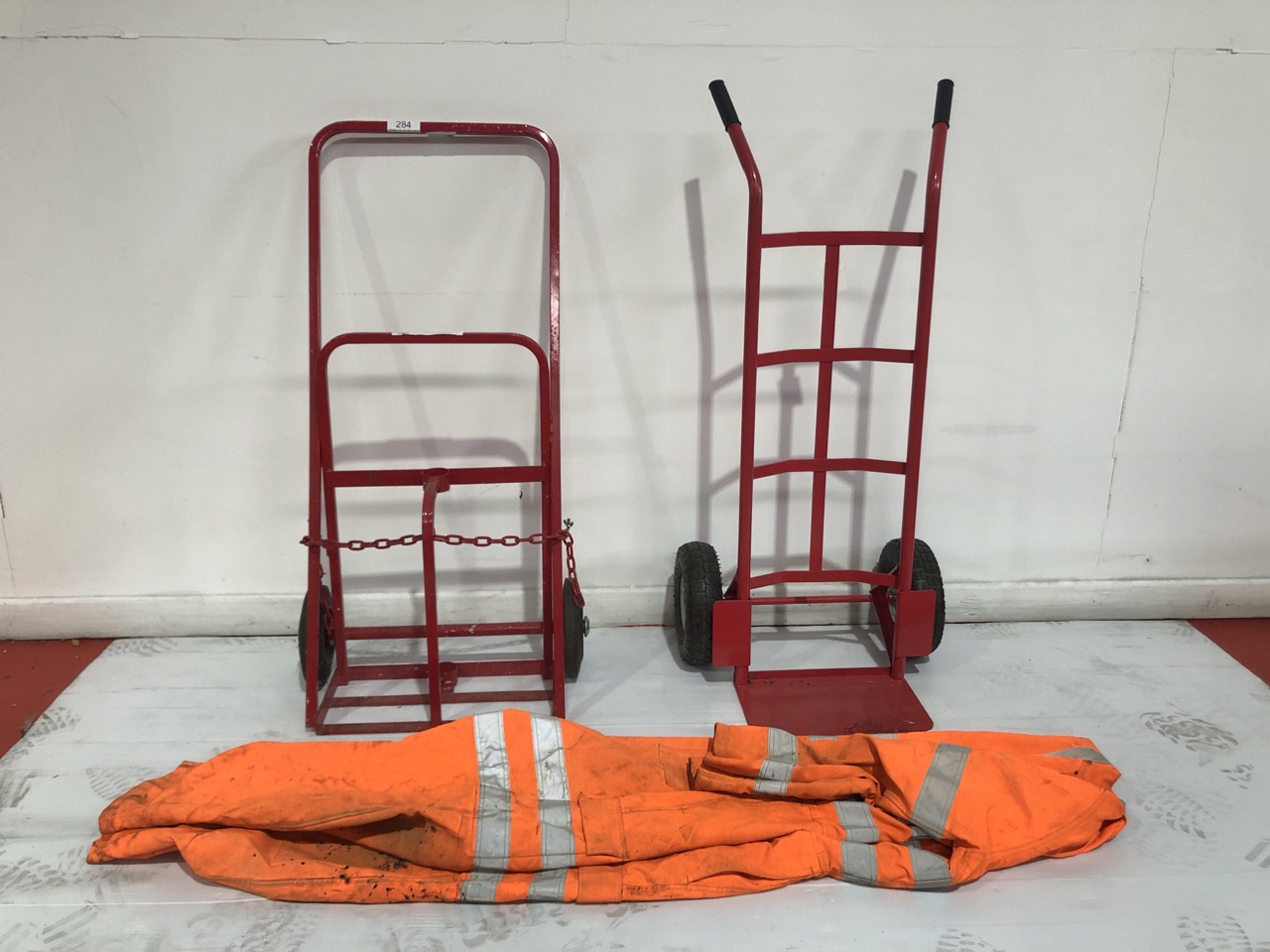 John Pye Auctions - 1X RED SACK TROLLEY 1X RED CYLINDER TROLLEY 1X ...
